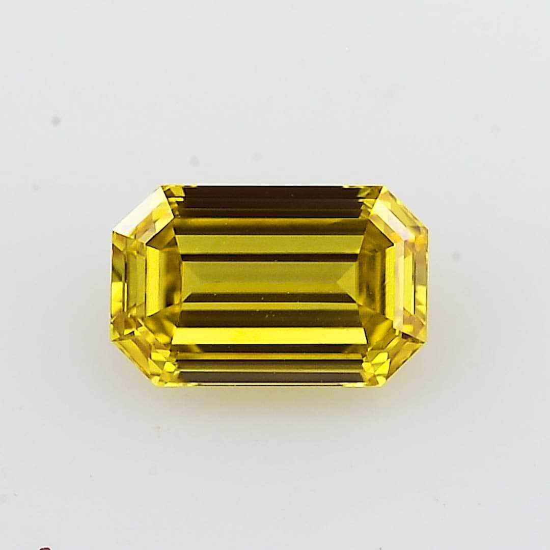 0 93 Carat Fancy Vivid Orangy Yellow Diamond Emerald Shape VVS2 0-93-carat-fancy-vivid-orangy-yellow-diamond-emerald-shape-vvs2